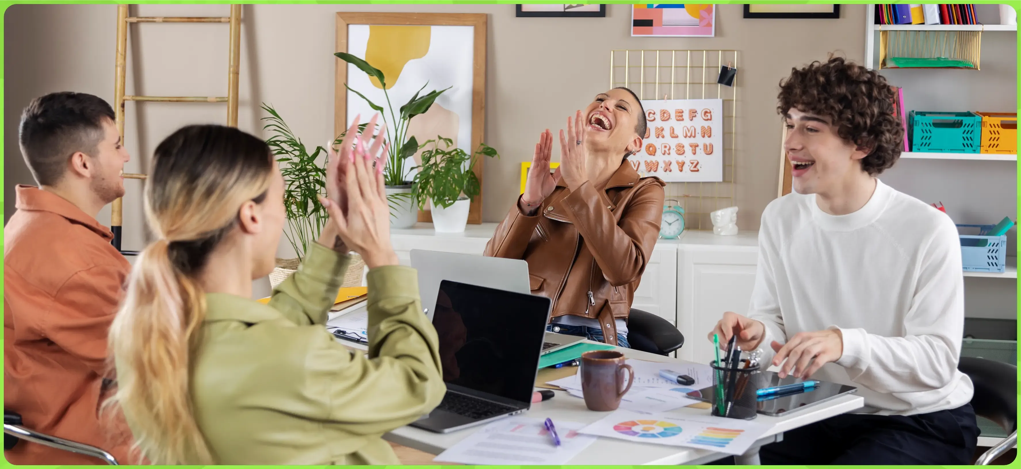 Office team laughing and clapping while playing a fun Jeopardy-style ...